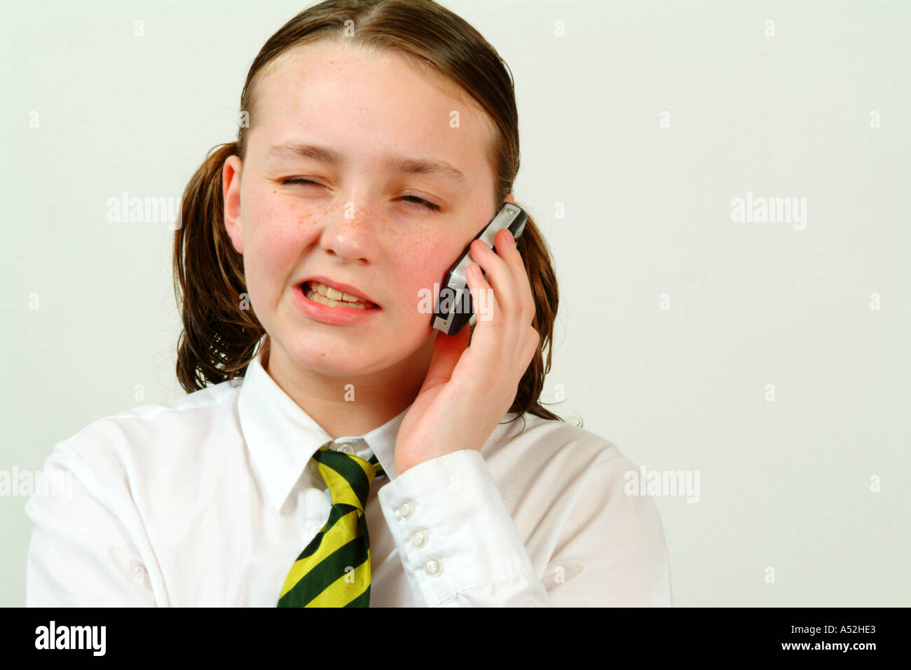 girl guessing on phone portrait Stock Photo - Alamy