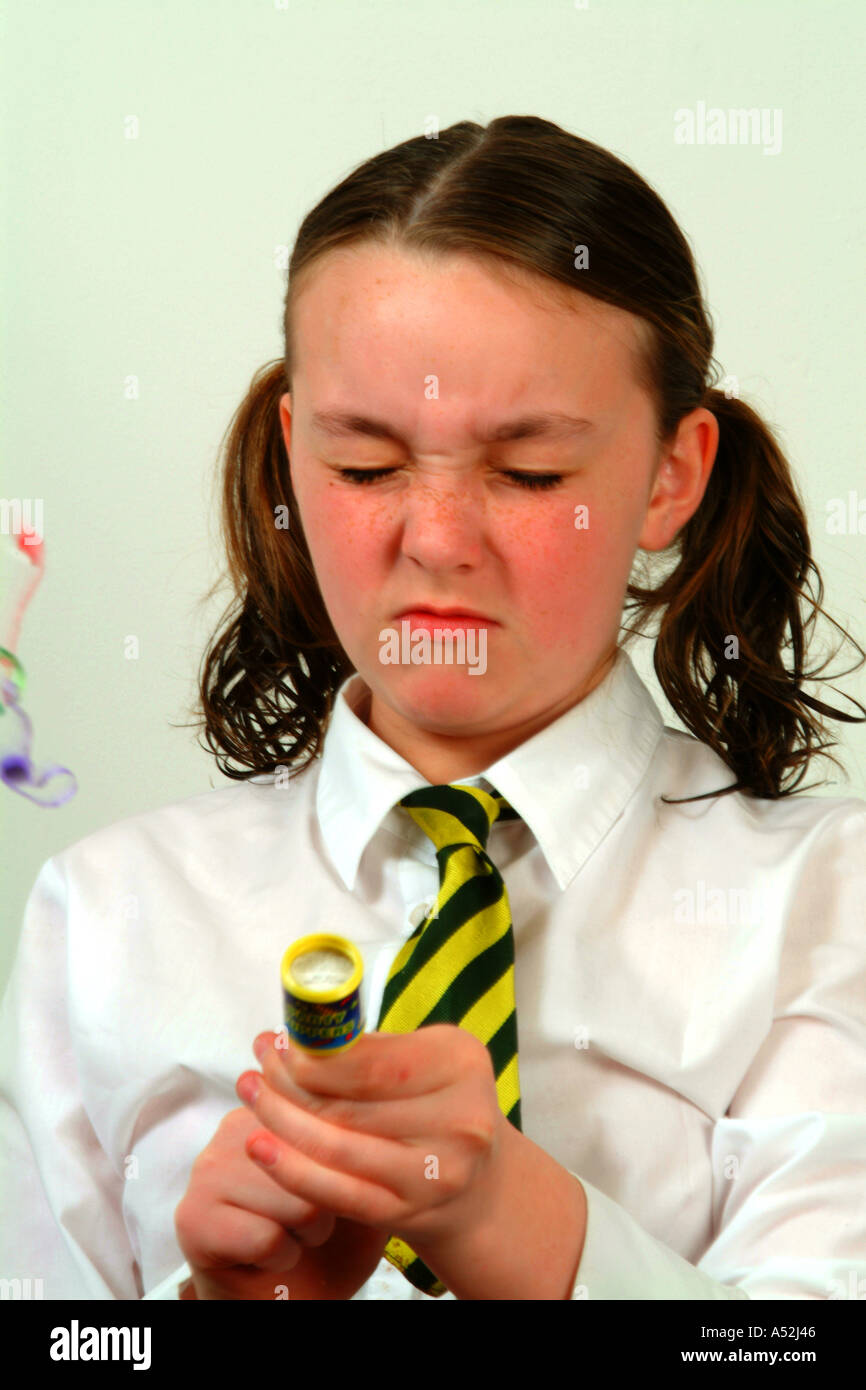 girl pulling a party popper off Stock Photo - Alamy