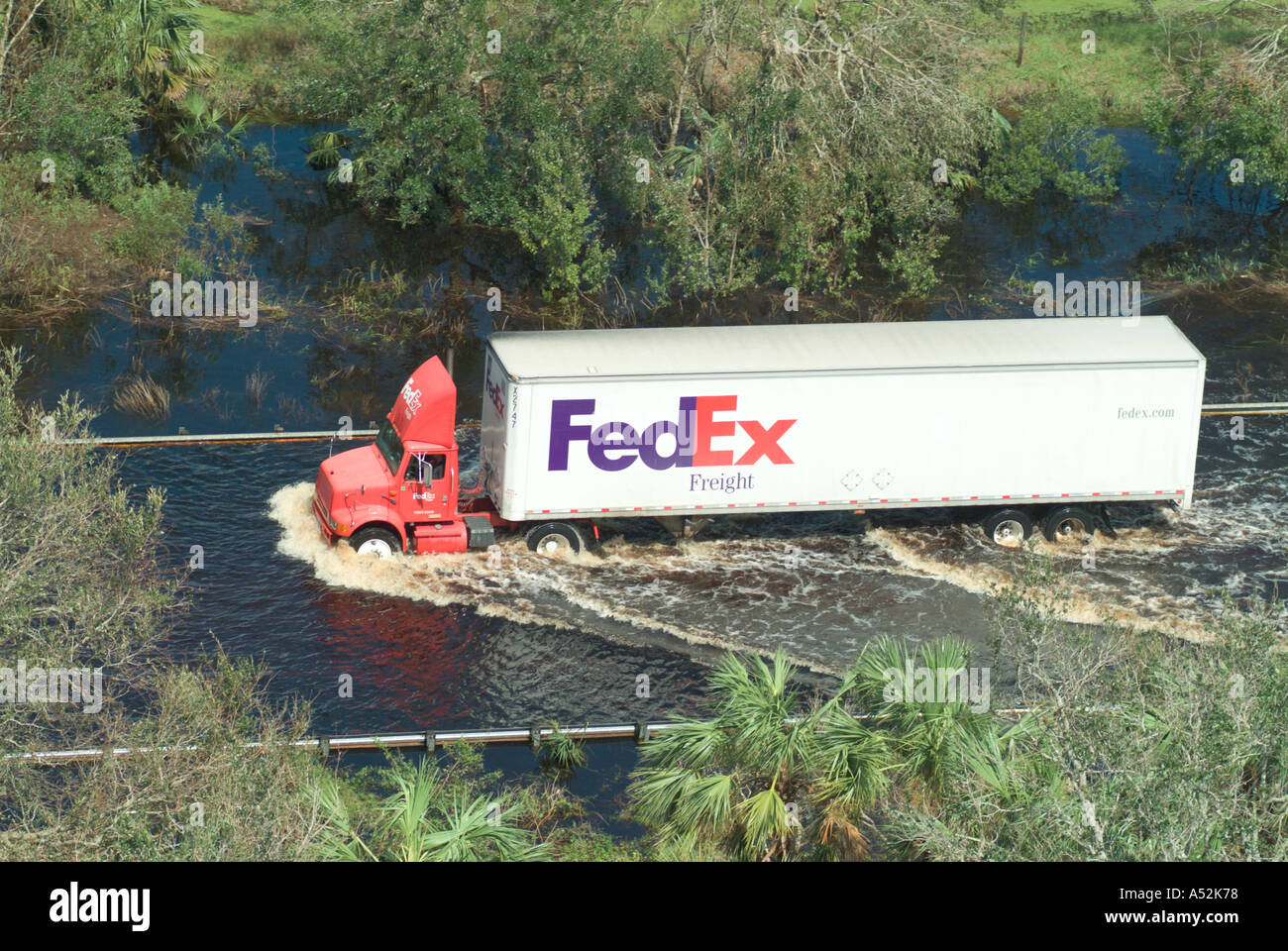 Federal Express Truck FedEx driving through flooded road after Florida ...