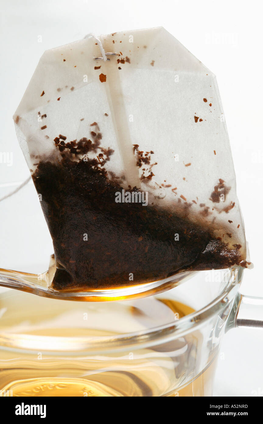 Used tea bag on teacup Stock Photo - Alamy