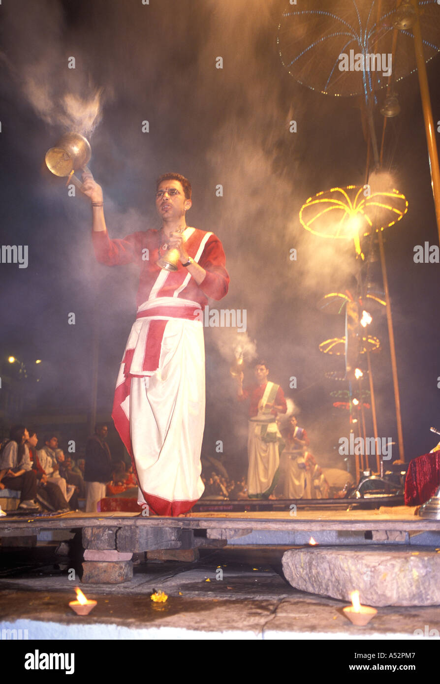 Hindu priests performing the Deepmala Ceremony at a Ghat on the banks ...