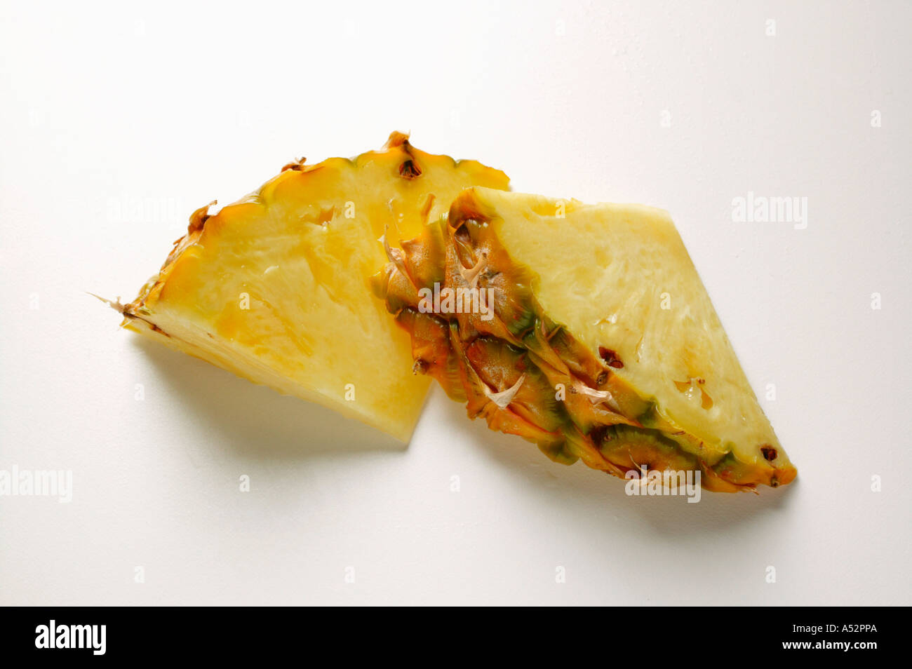 Two wedges of pineapple Stock Photo - Alamy