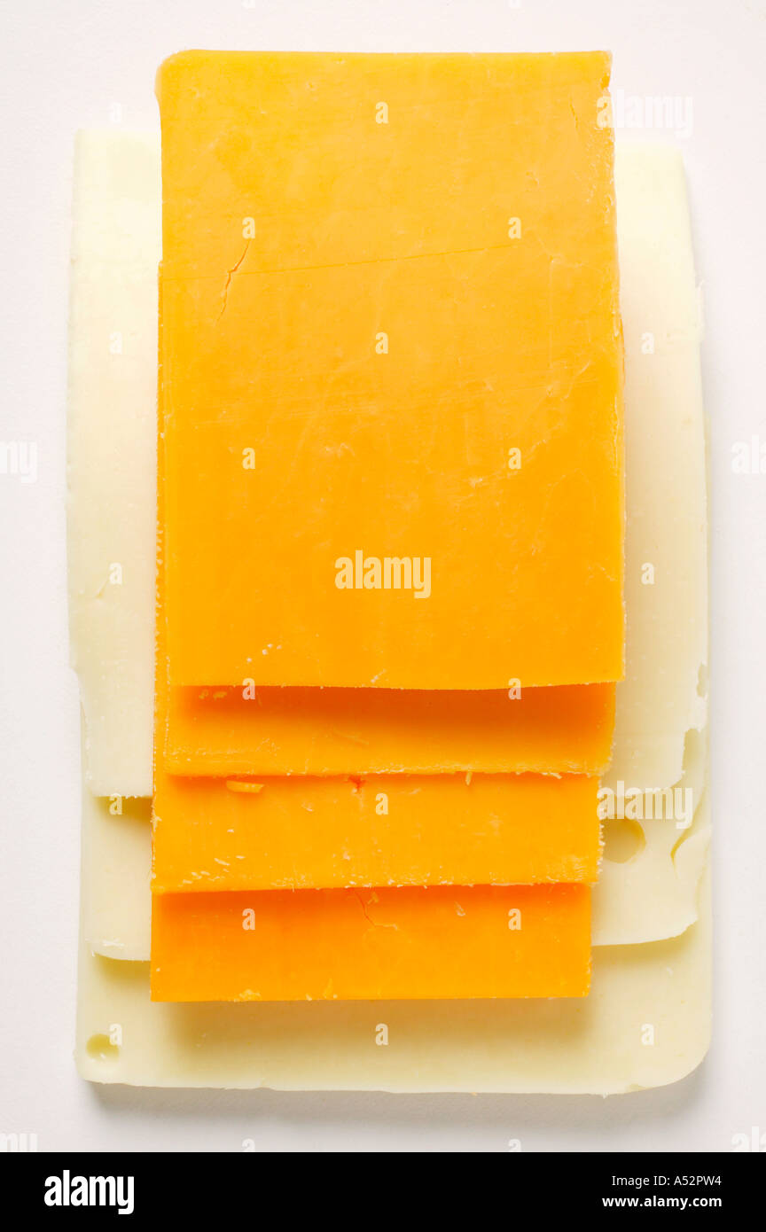 Cheese slices Extra Sharp Cheddar on American cheese Stock Photo - Alamy