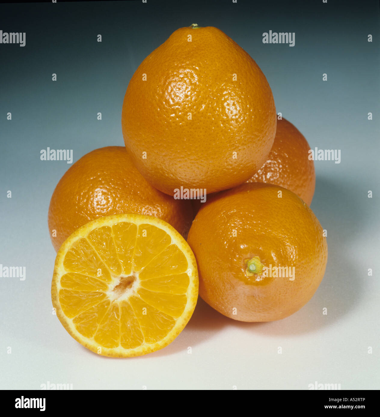 Whole and sectioned orange fruit variety Mineola Tangelo Stock Photo ...