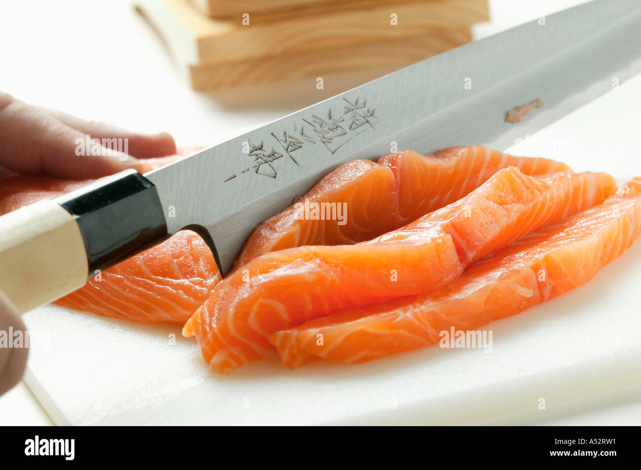 Cutting salmon for sushi Stock Photo - Alamy