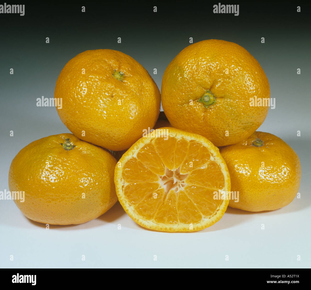 Whole and sectioned well coloured mandarin fruit variety Satsuma Stock ...