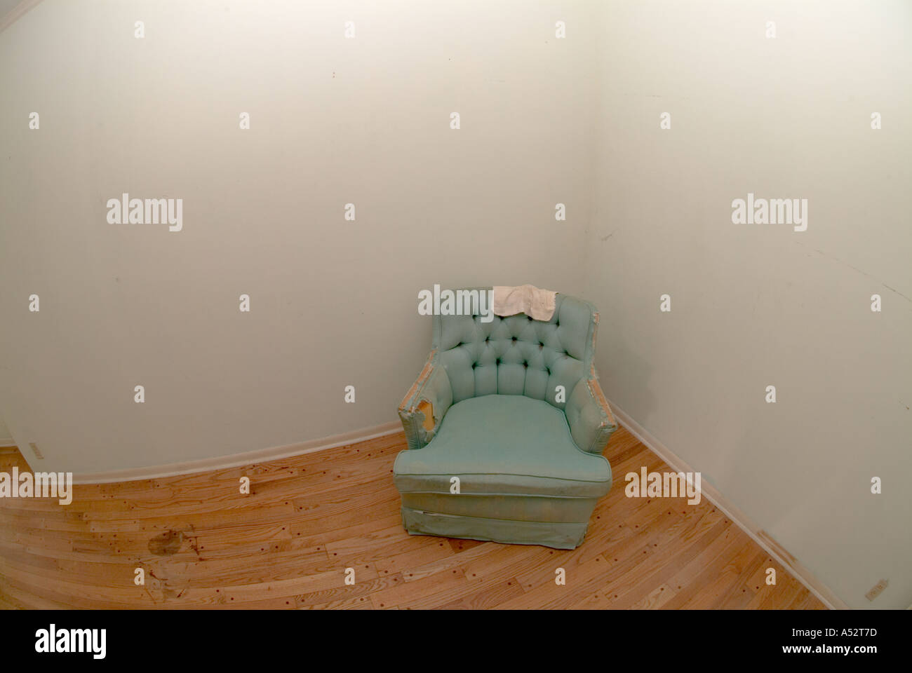 old chair in empty room corner old house tattered worn poor poverty ...