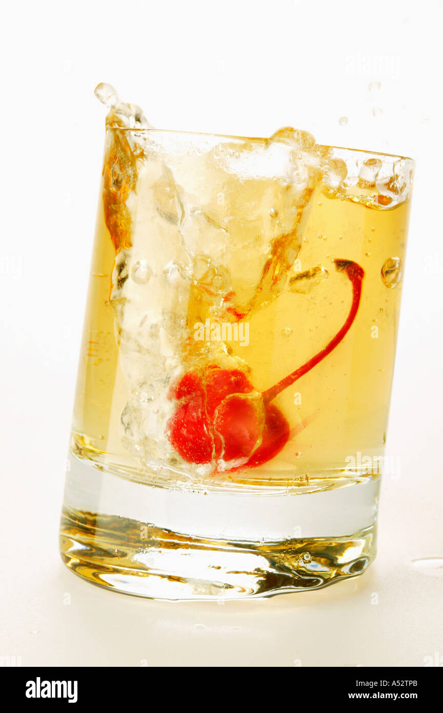Ginger Ale with cocktail cherry splashing out of glass Stock Photo - Alamy