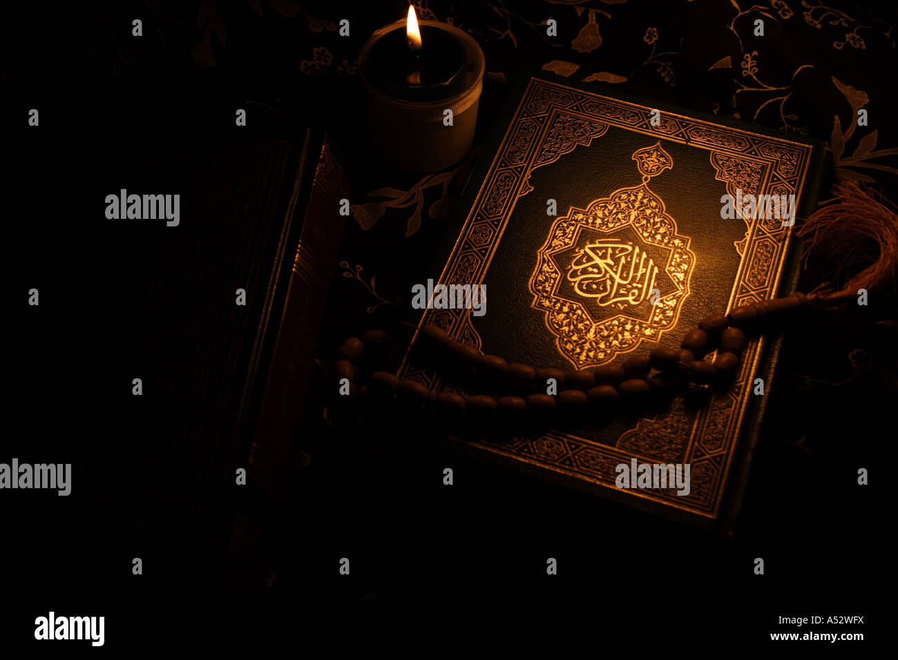 Holy Koran with rosary Stock Photo - Alamy