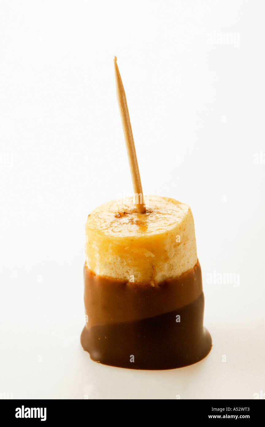 Chocolate coated banana on toothpick Stock Photo - Alamy