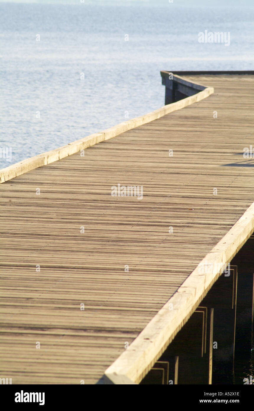 wooden boardwalk along water Riverwalk pathway backgrounds Stock Photo ...