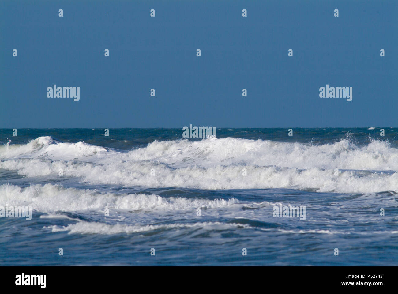 ocean waves rough water beach coastal seashore Stock Photo - Alamy