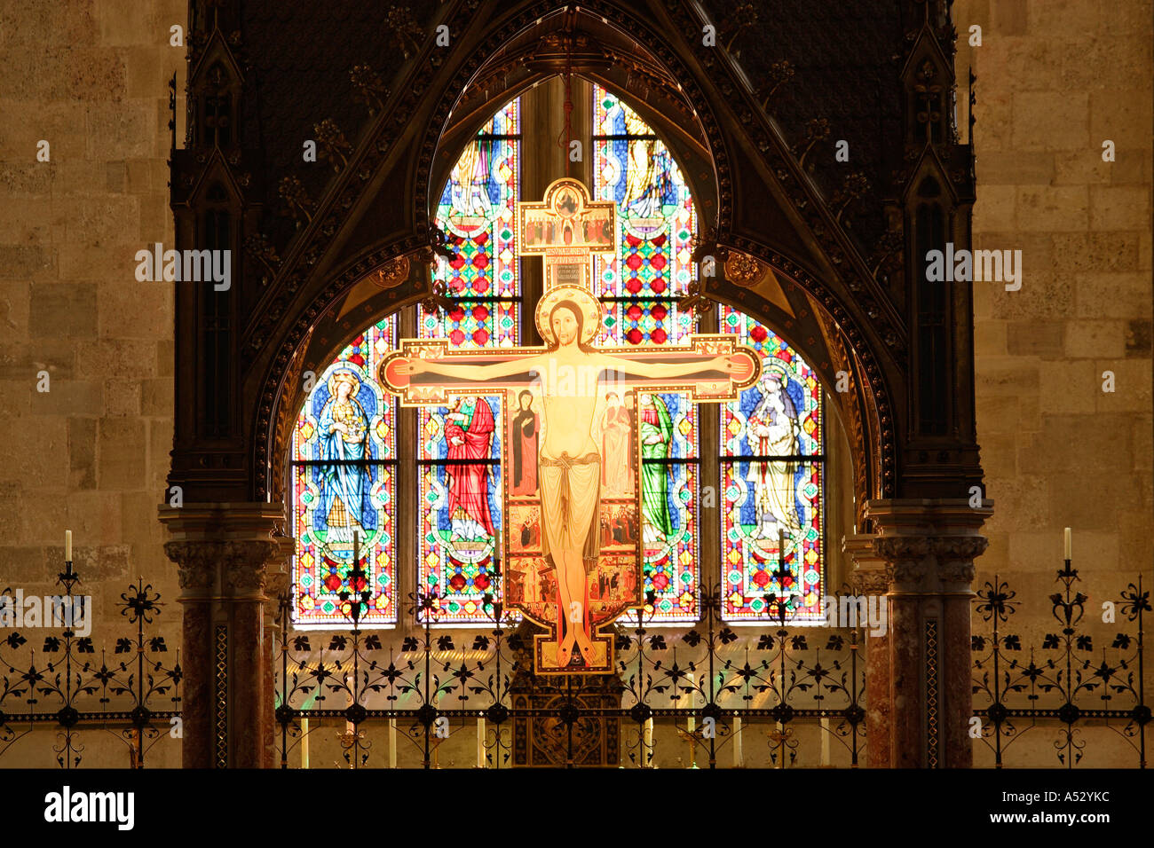Romanic cross in front of glass window in church of Heiligenkreuz Lower ...