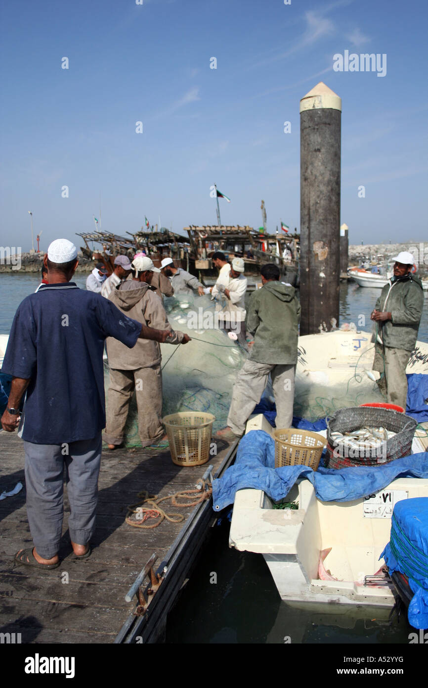 fishers in kuwaiti harbor Stock Photo - Alamy