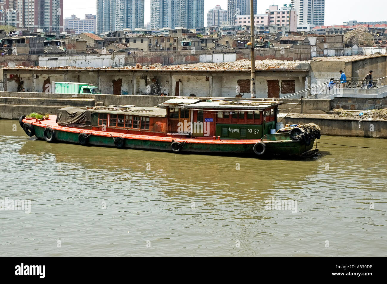 Barge moored in area of reconstruction, Shanghai Stock Photo - Alamy