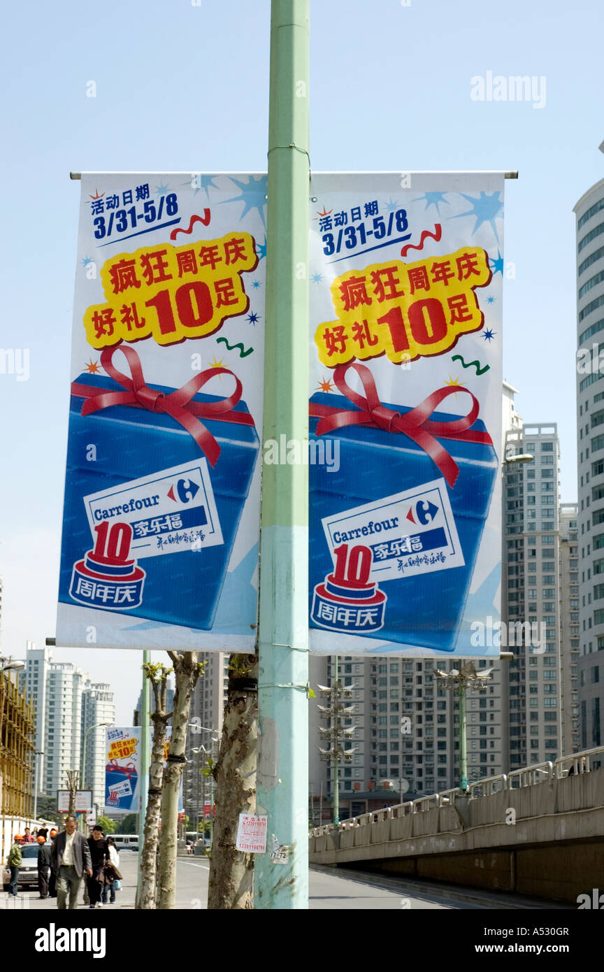 Advertising banner hanging from lampost for Carrefour Supermarket ...