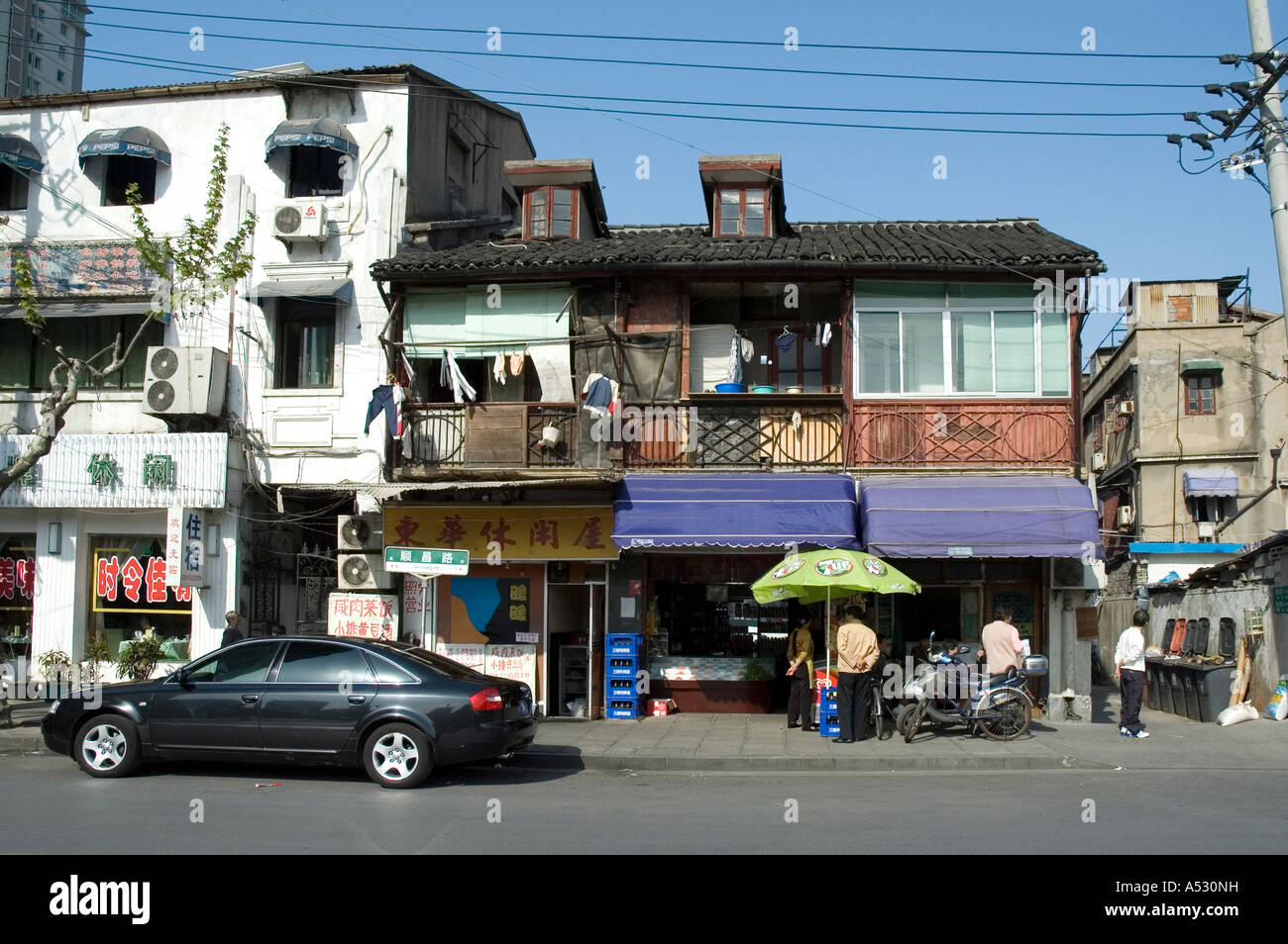 Shops and cafe in classical old building, Shanghai Stock Photo - Alamy