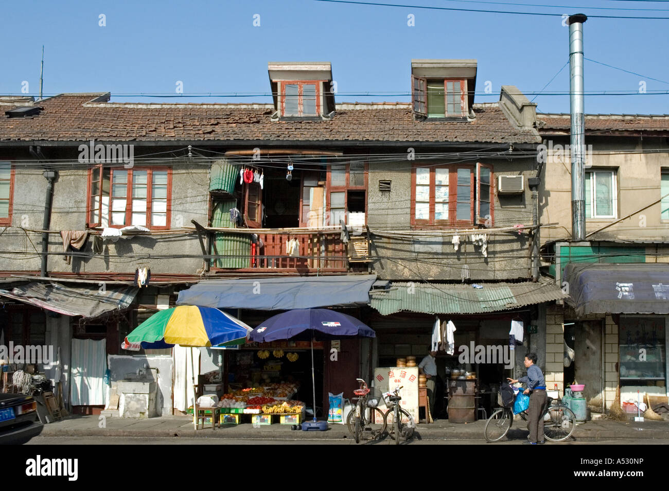Small shops and cafes in old buildings, Shanghai Stock Photo - Alamy