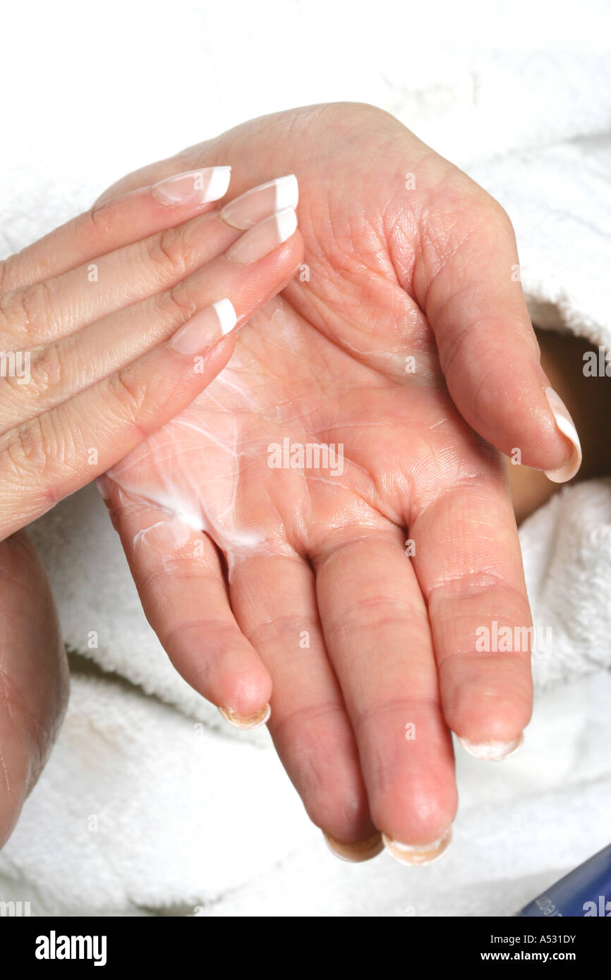 Young Woman Applying Hand Cream Model Released Stock Photo - Alamy