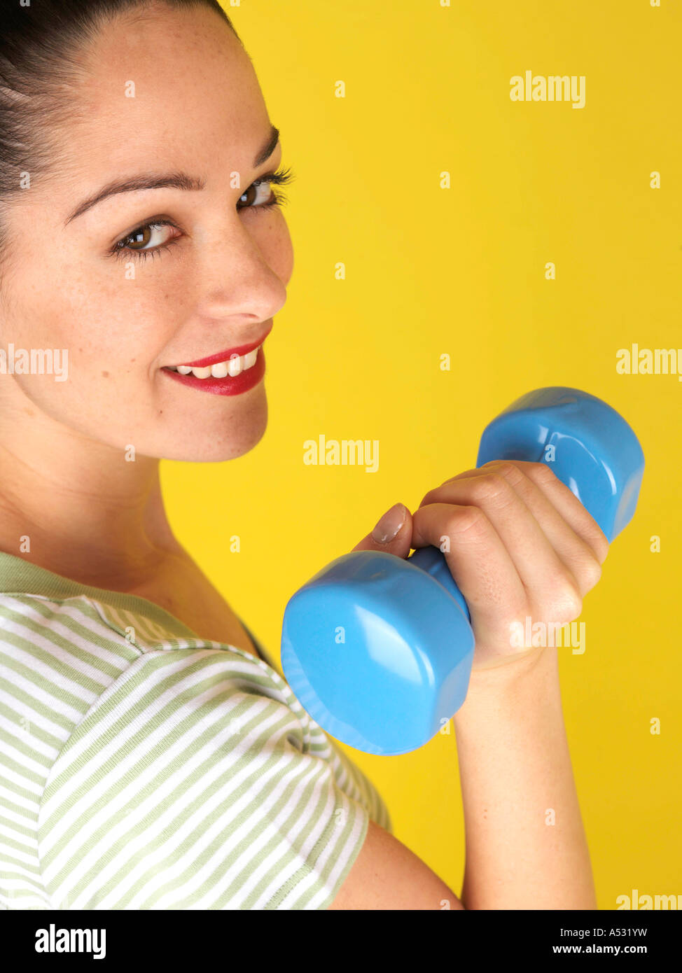 Young Woman Lifting Weights Model Released Stock Photo - Alamy