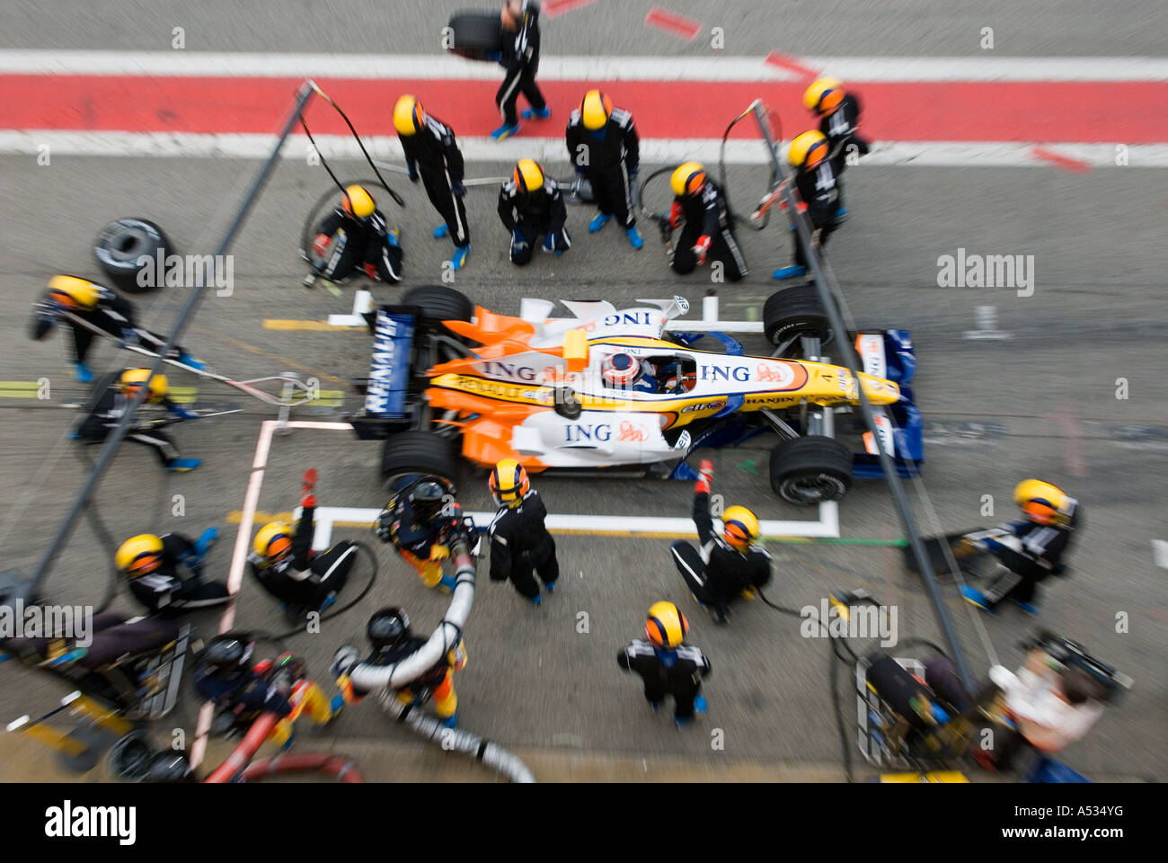 Heikki Kovalainen (FIN) makes a pit stop in the Renault R27 during ...