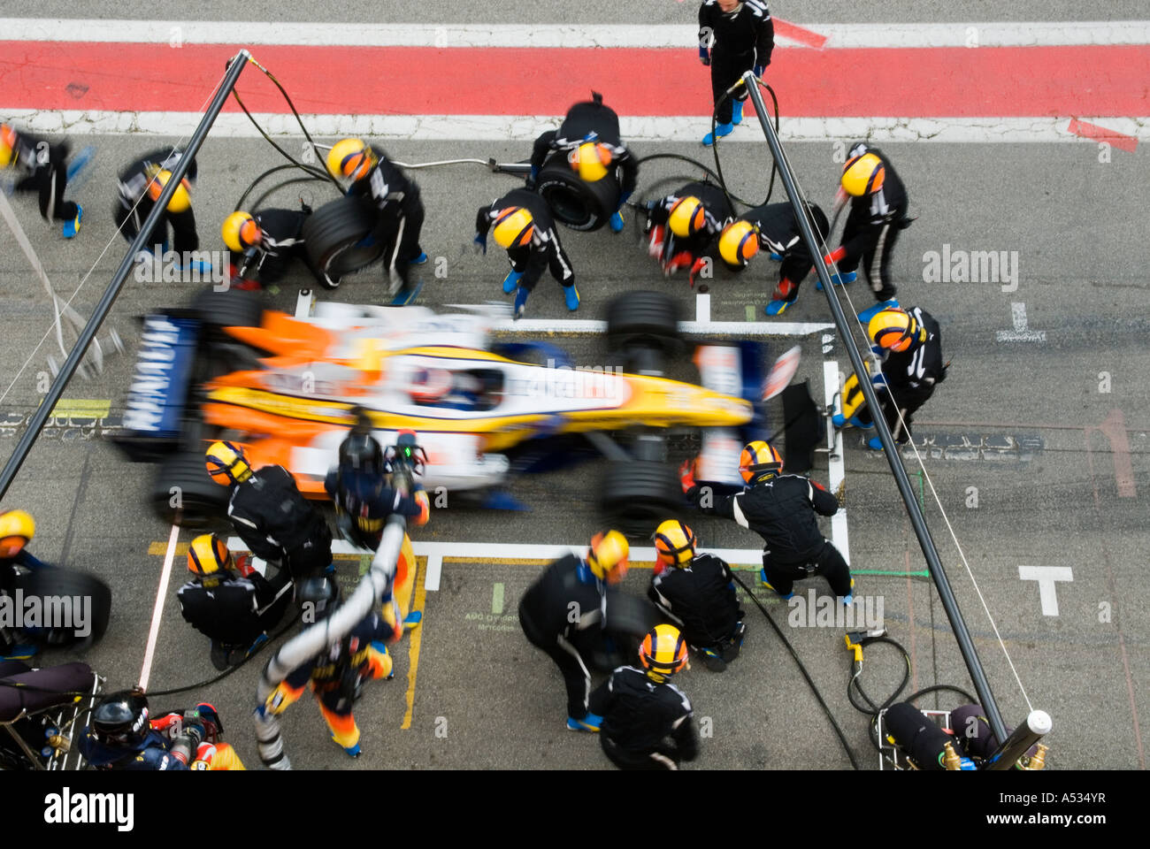 Heikki Kovalainen (FIN) makes a pit stop in the Renault R27 during ...
