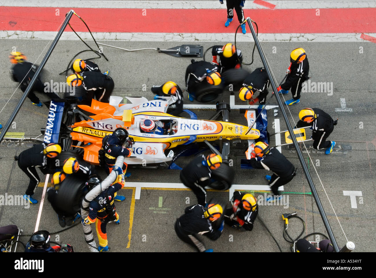 Heikki Kovalainen (FIN) makes a pit stop in the Renault R27 during ...