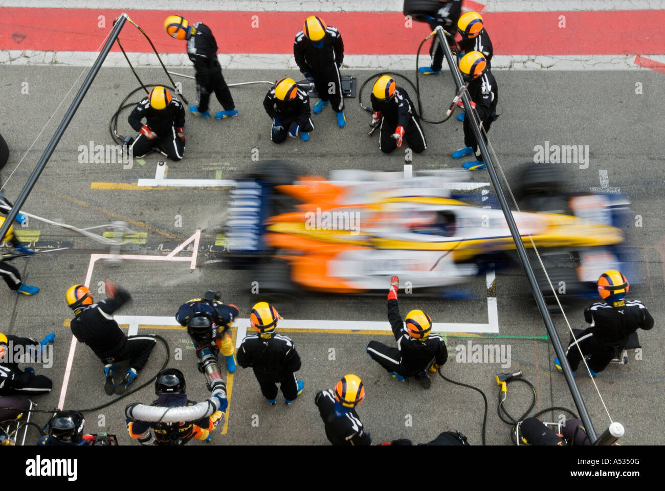 Heikki Kovalainen (FIN) makes a pit stop in the Renault R27 during ...
