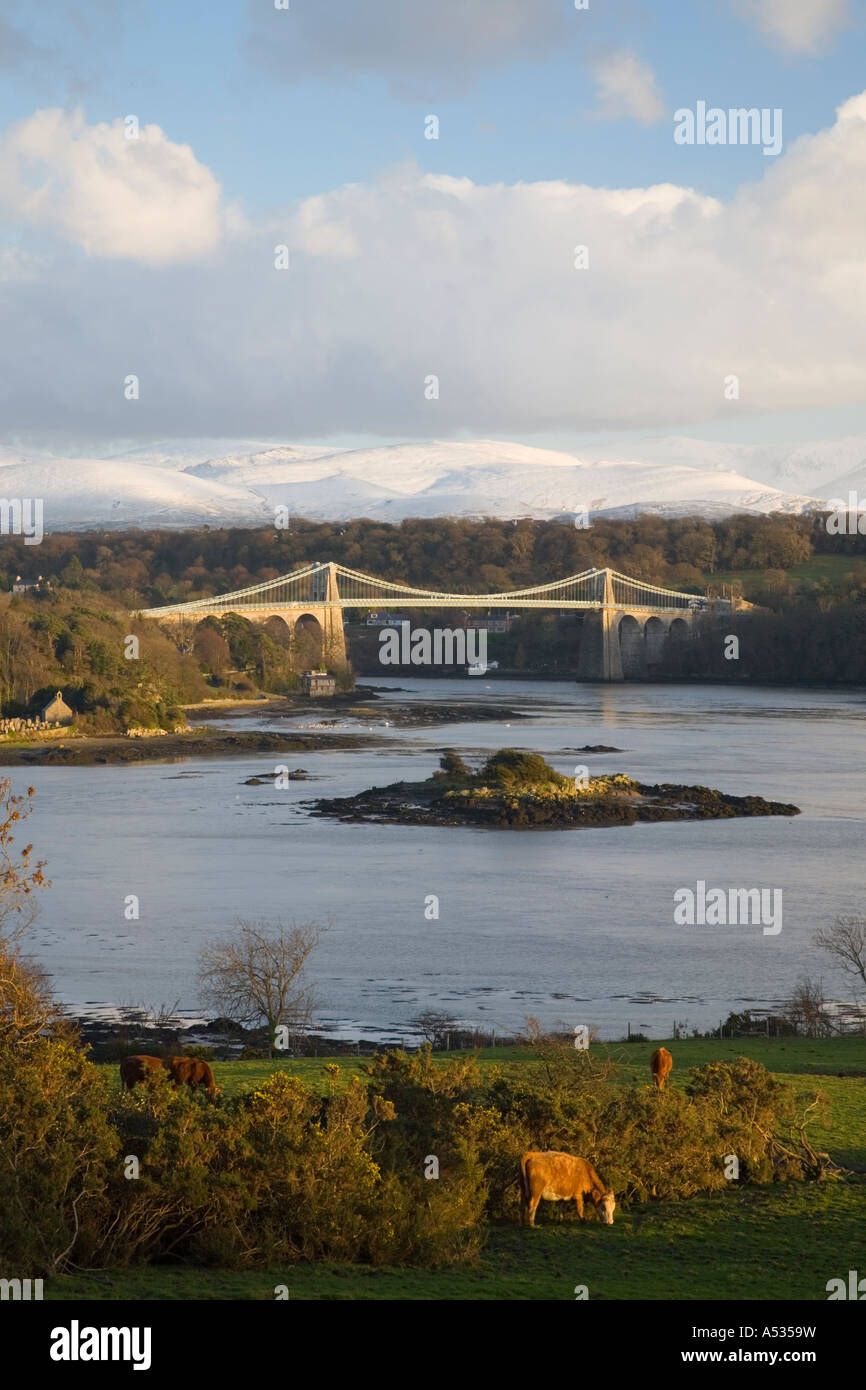 Menai Suspension Bridge 1826 across Menai Strait with snow on mountains ...