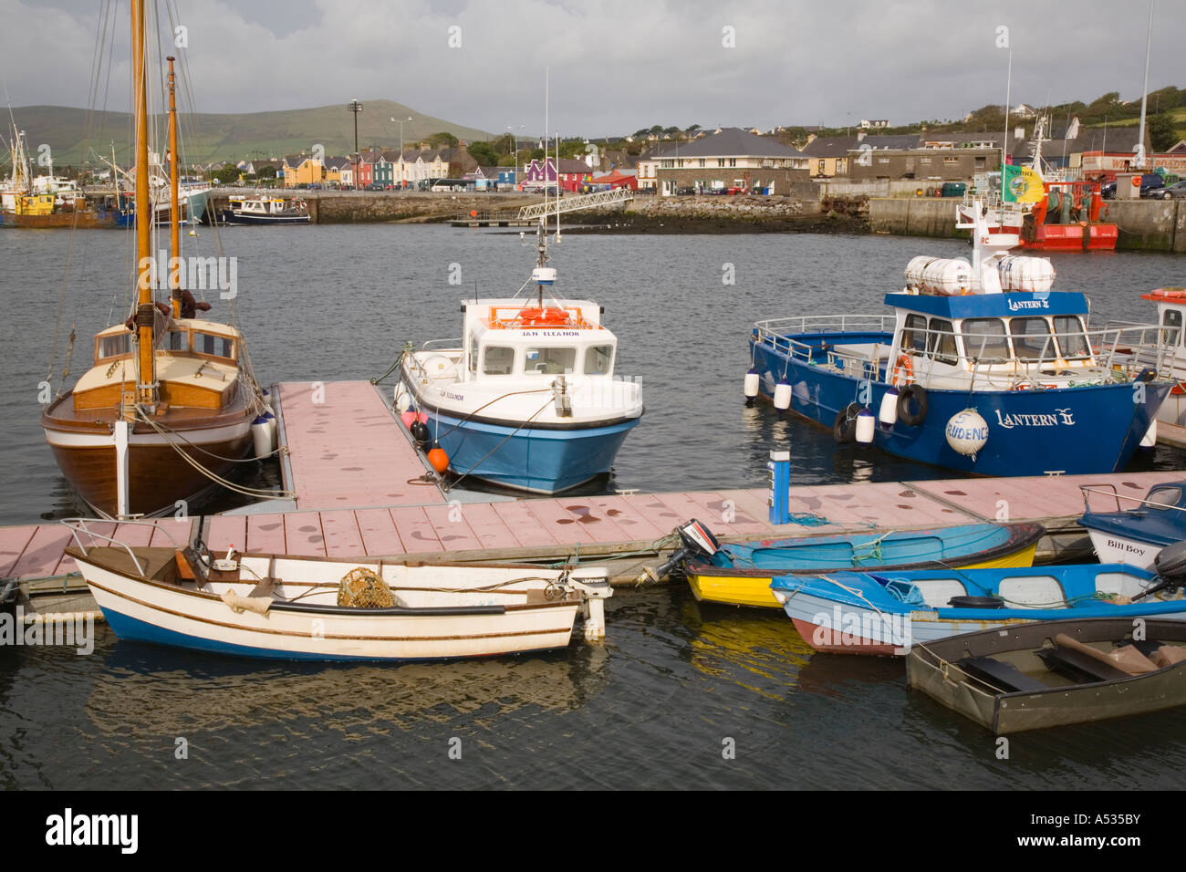 Natural harbour fishing port with moored boats on Dingle Peninsula ...