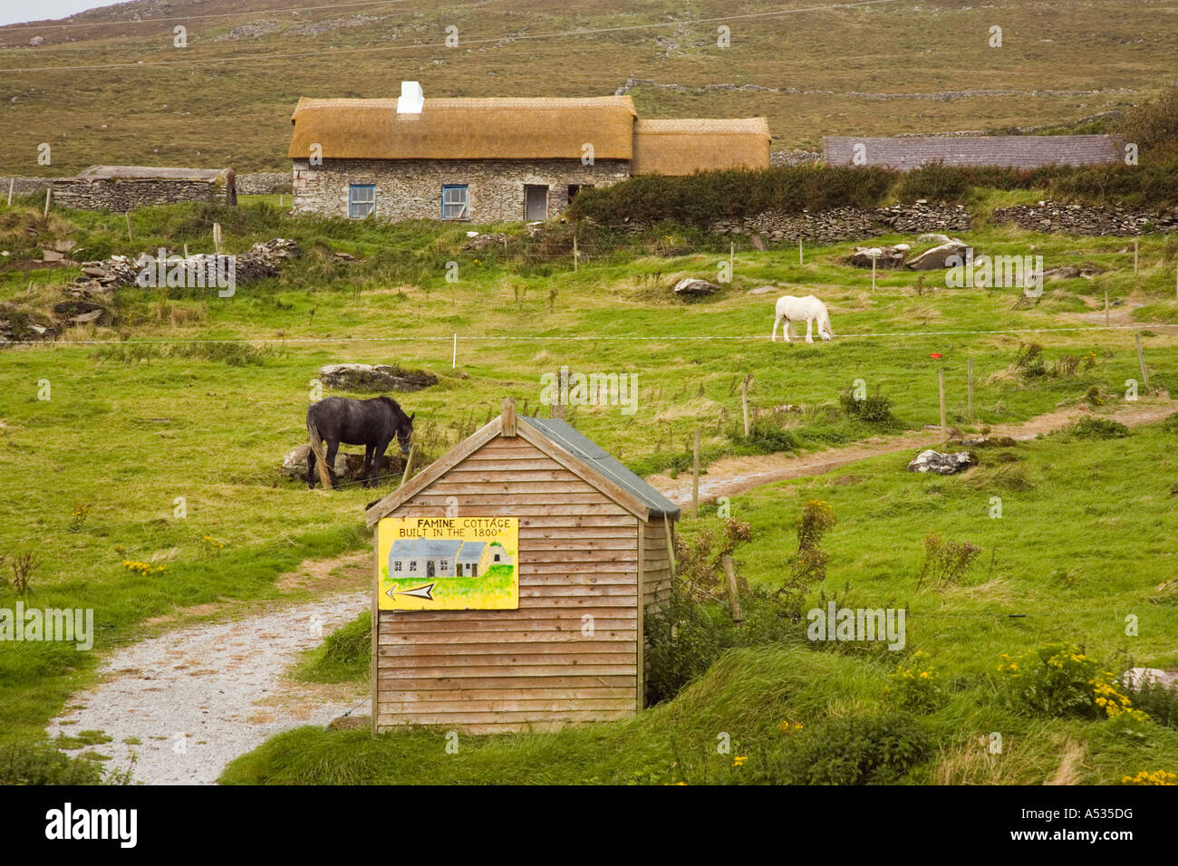 Entrance to 19th century thatched Famine Cottage tourist attraction ...