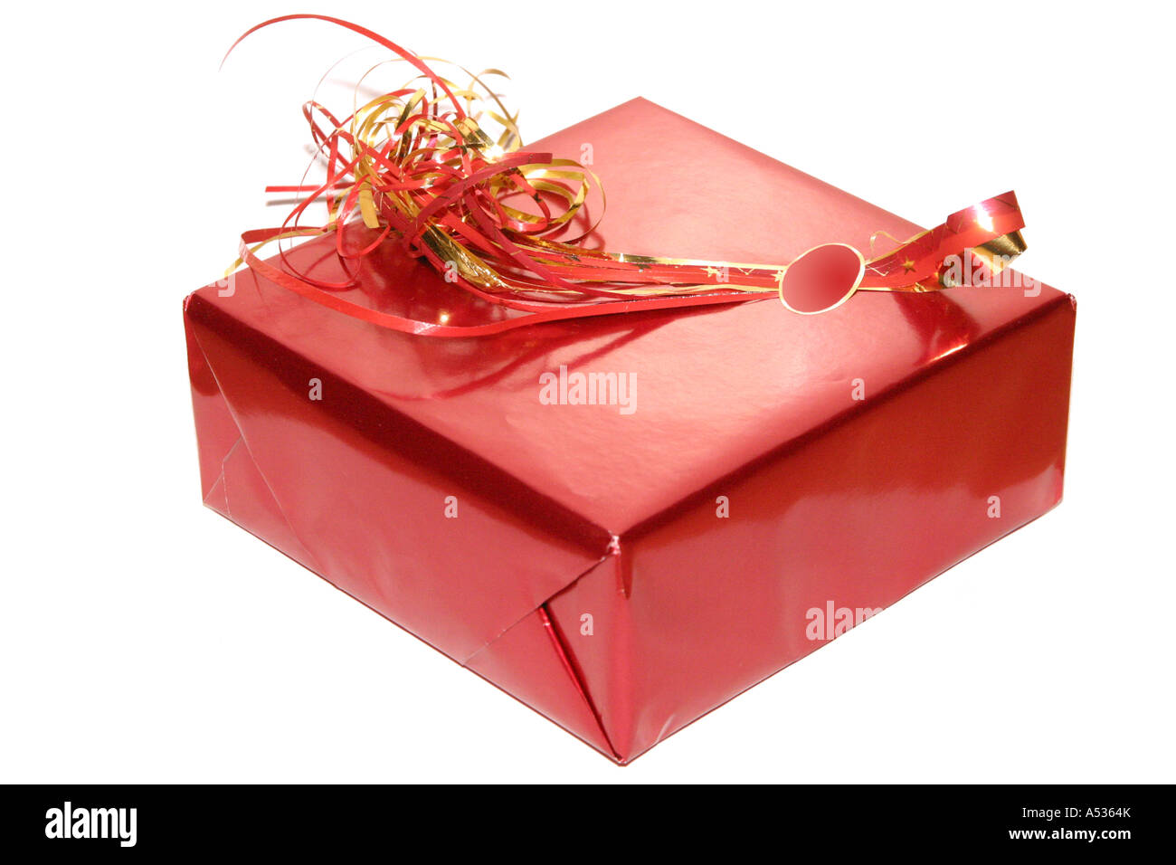 Red shiny present on white background Stock Photo - Alamy