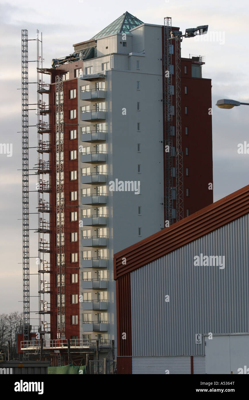 Constructing a high rise block building. On the left side there is an ...