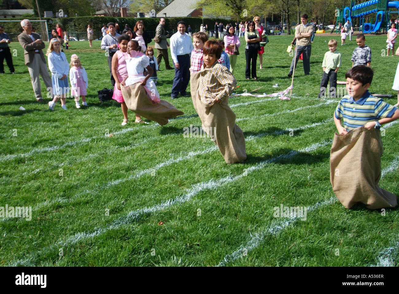 Easter field day sack race Stock Photo - Alamy