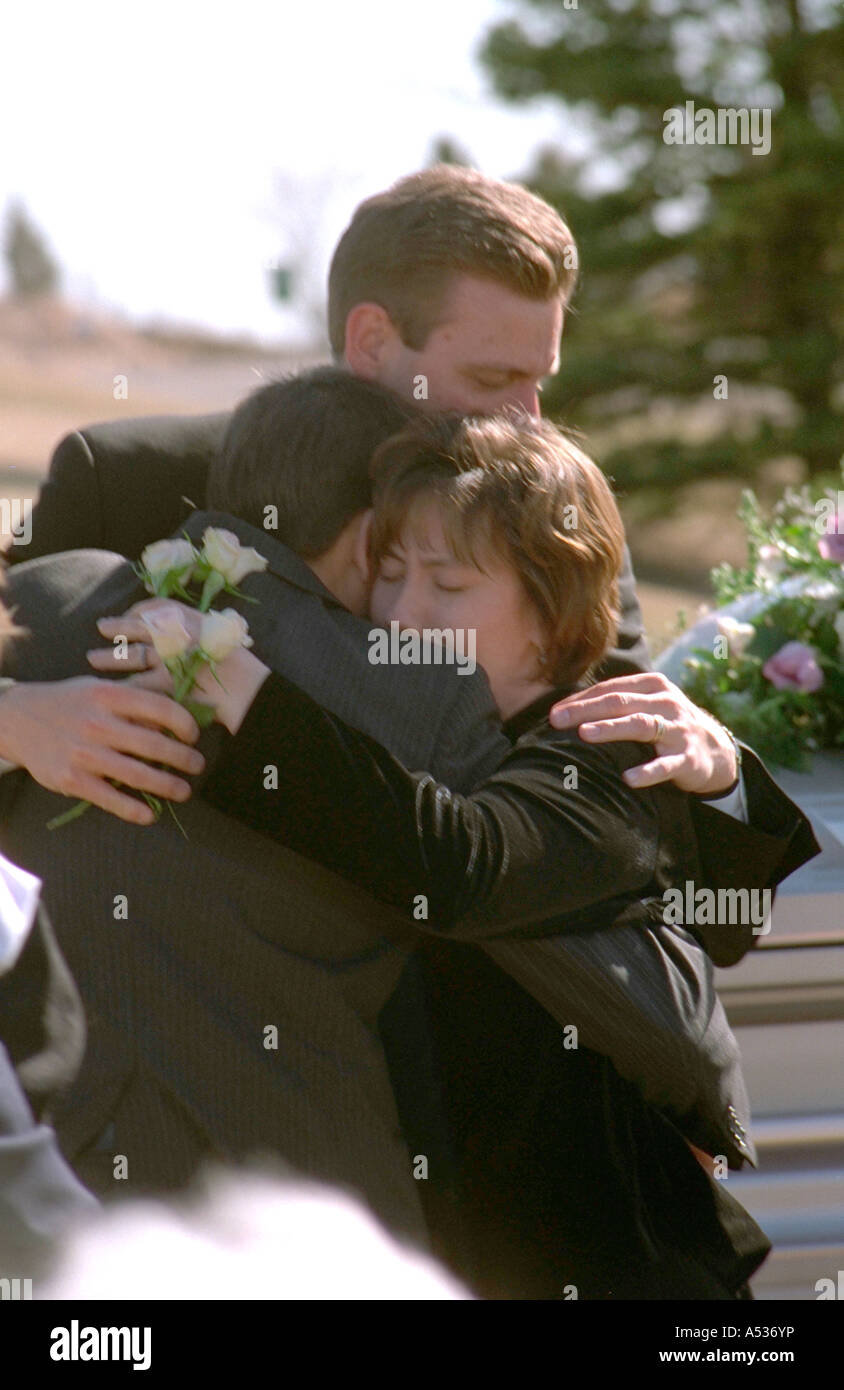 Children hugging at Mother's funeral. Buffalo Minnesota USA Stock Photo ...