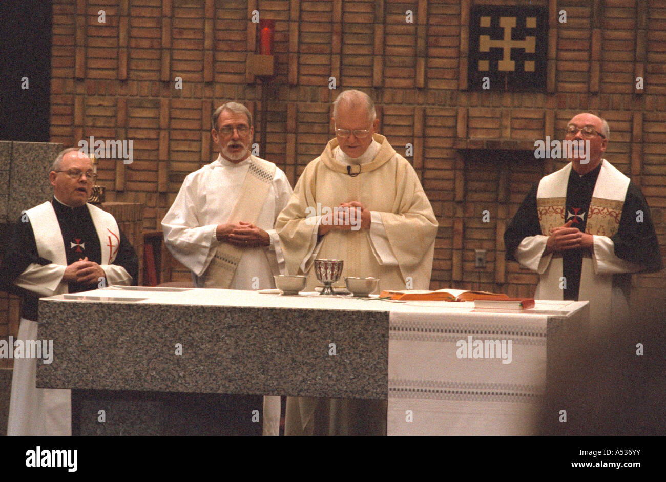 Priests performing communion. St. Alphonsus Catholic Church Brooklyn ...