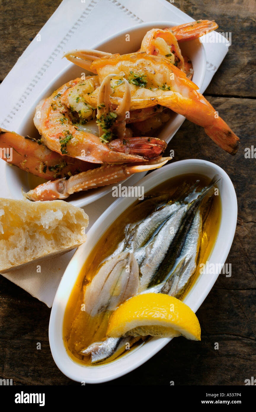 Marinated sardines and fried scampi Stock Photo - Alamy