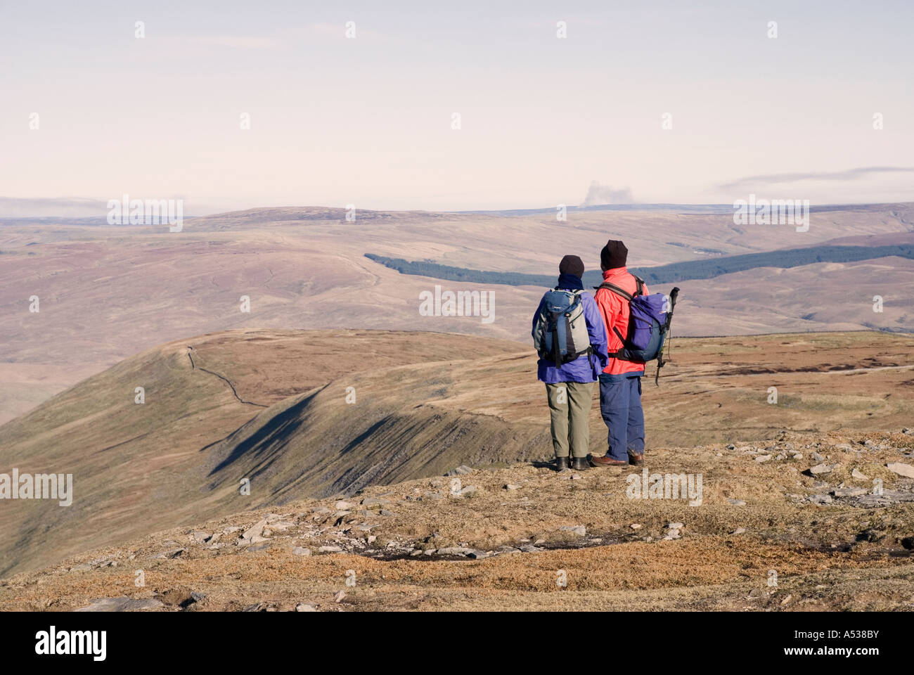 Couple walking on Ingleborough, Yorkshire Dales, England, UK Stock ...