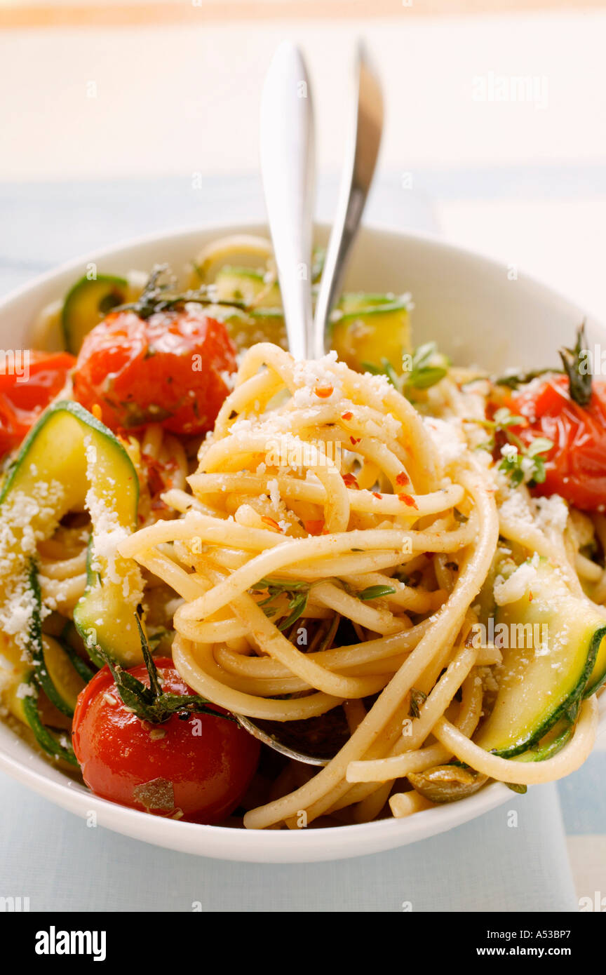 Spaghetti with cherry tomatoes and courgettes Stock Photo - Alamy