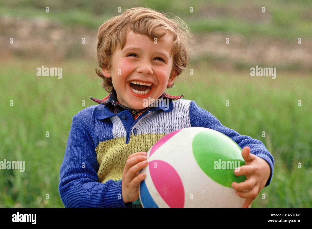 Playing with a ball Stock Photo - Alamy