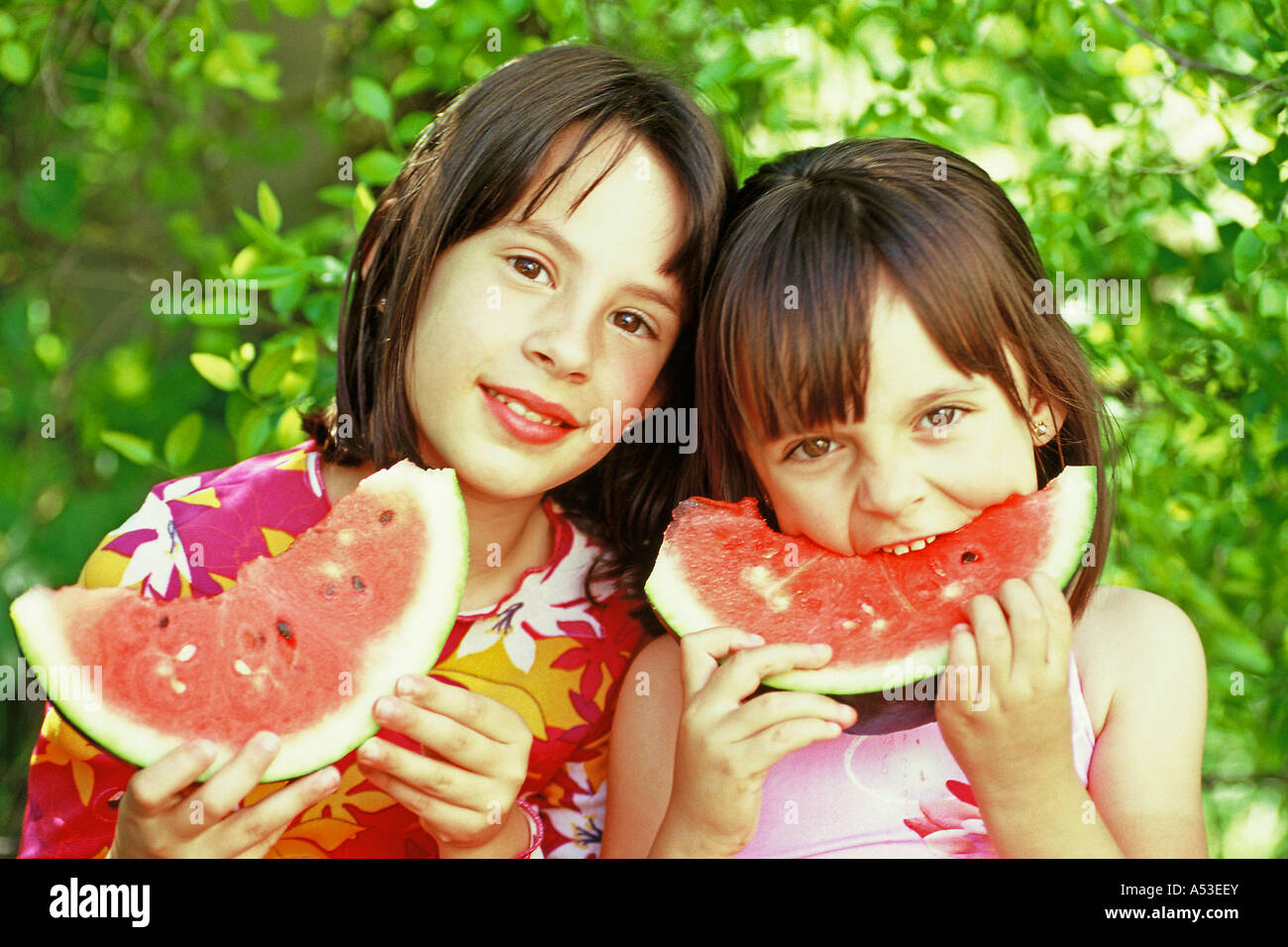 Girls with watermelon slices hi-res stock photography and images - Alamy