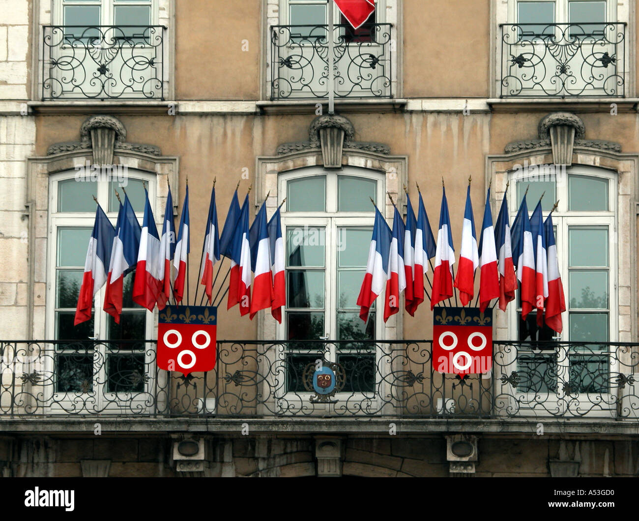 French tricolor flags on building exterior at Macon in Burgundy, France ...