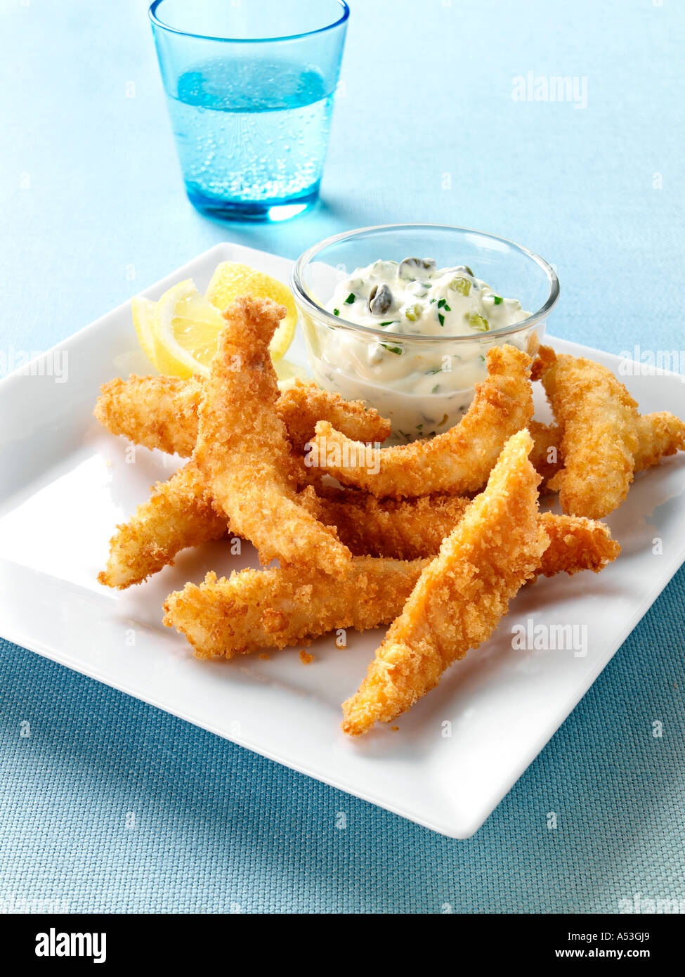 Breaded strips of fish with tartare sauce Stock Photo - Alamy