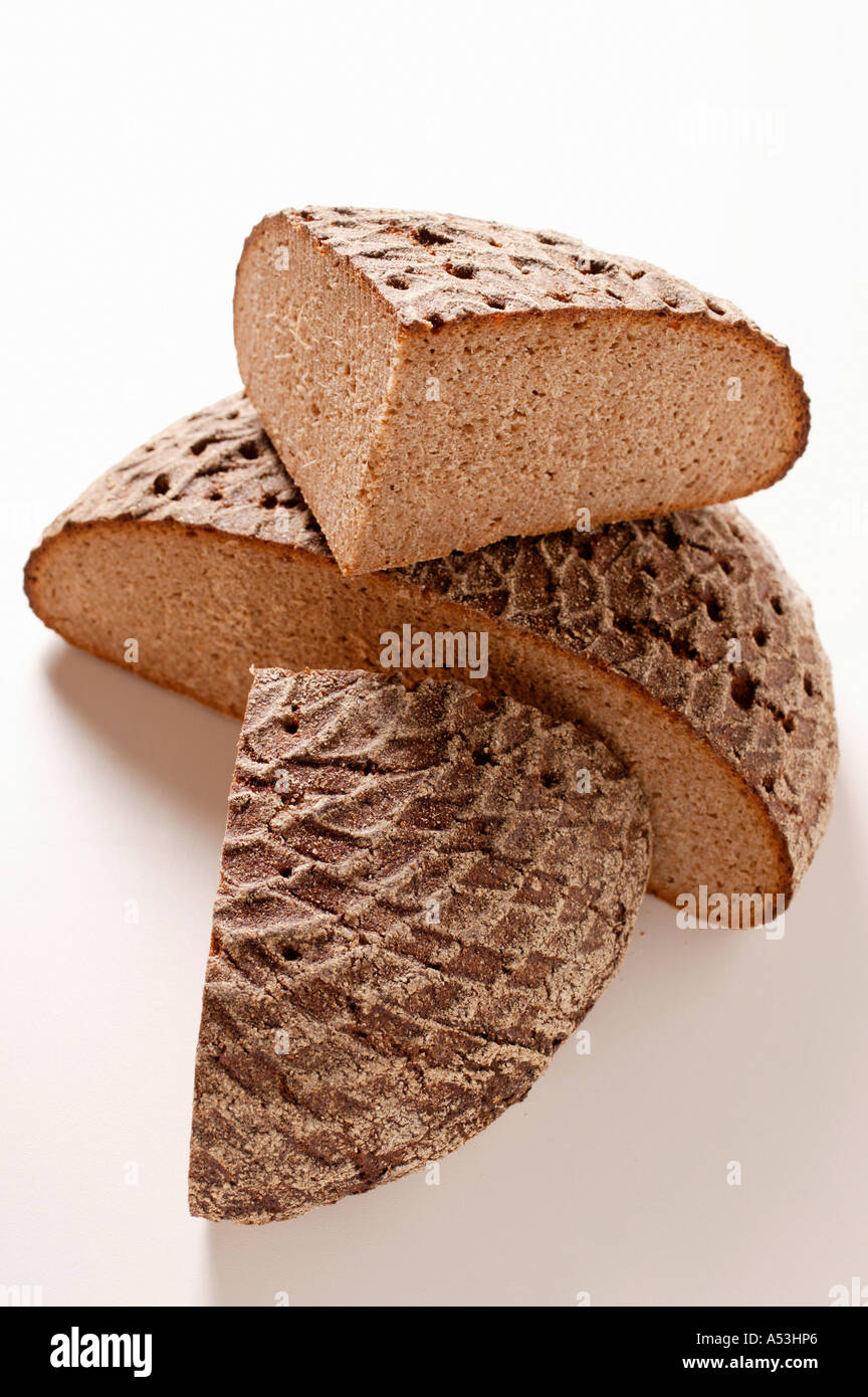 A loaf of farmhouse bread halved and two quarters Stock Photo - Alamy