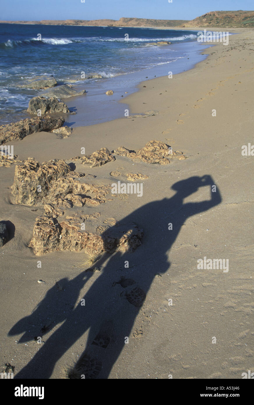Australia Western Australia Beach walker s shadow at sunset on Barrow ...