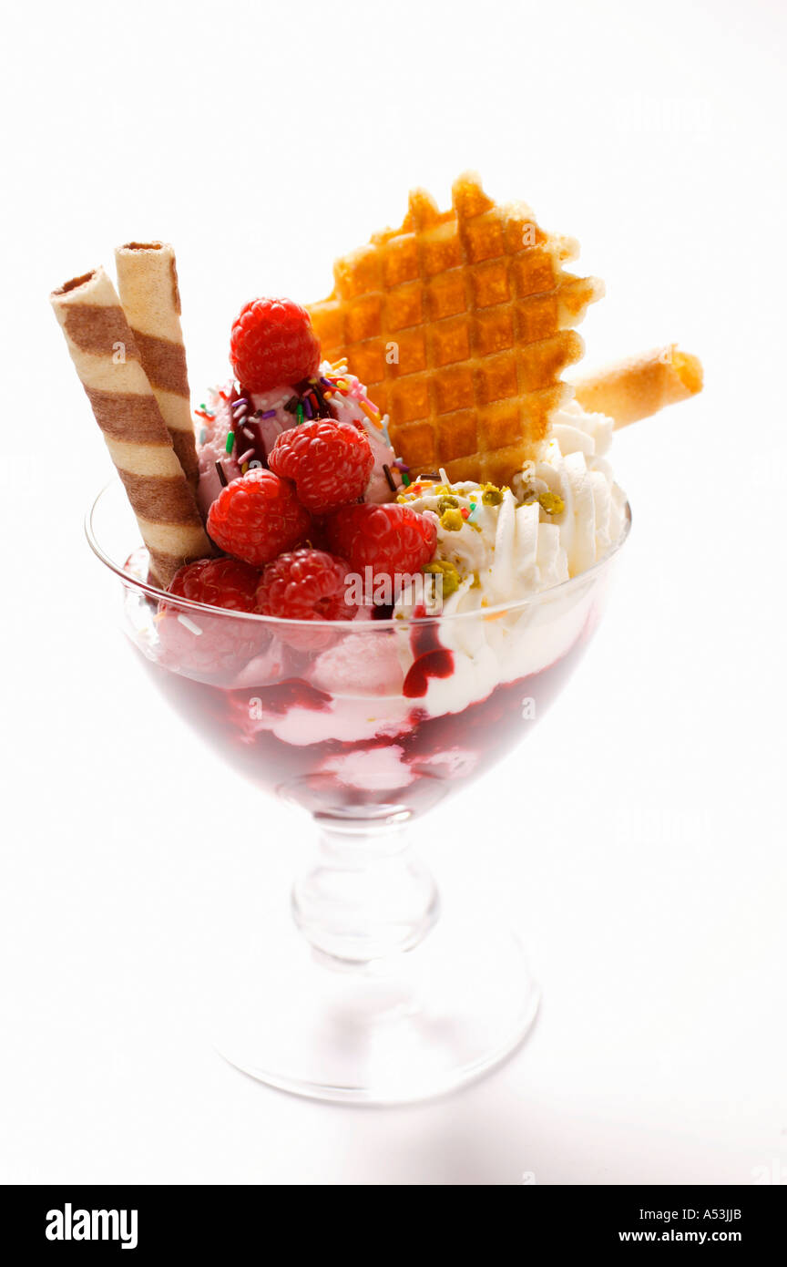 Sundae with raspberry ice cream cream wafers sprinkles Stock Photo - Alamy