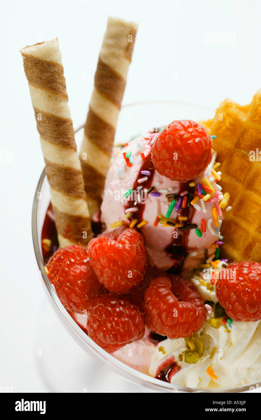 Sundae with raspberry ice cream cream wafers sprinkles Stock Photo - Alamy