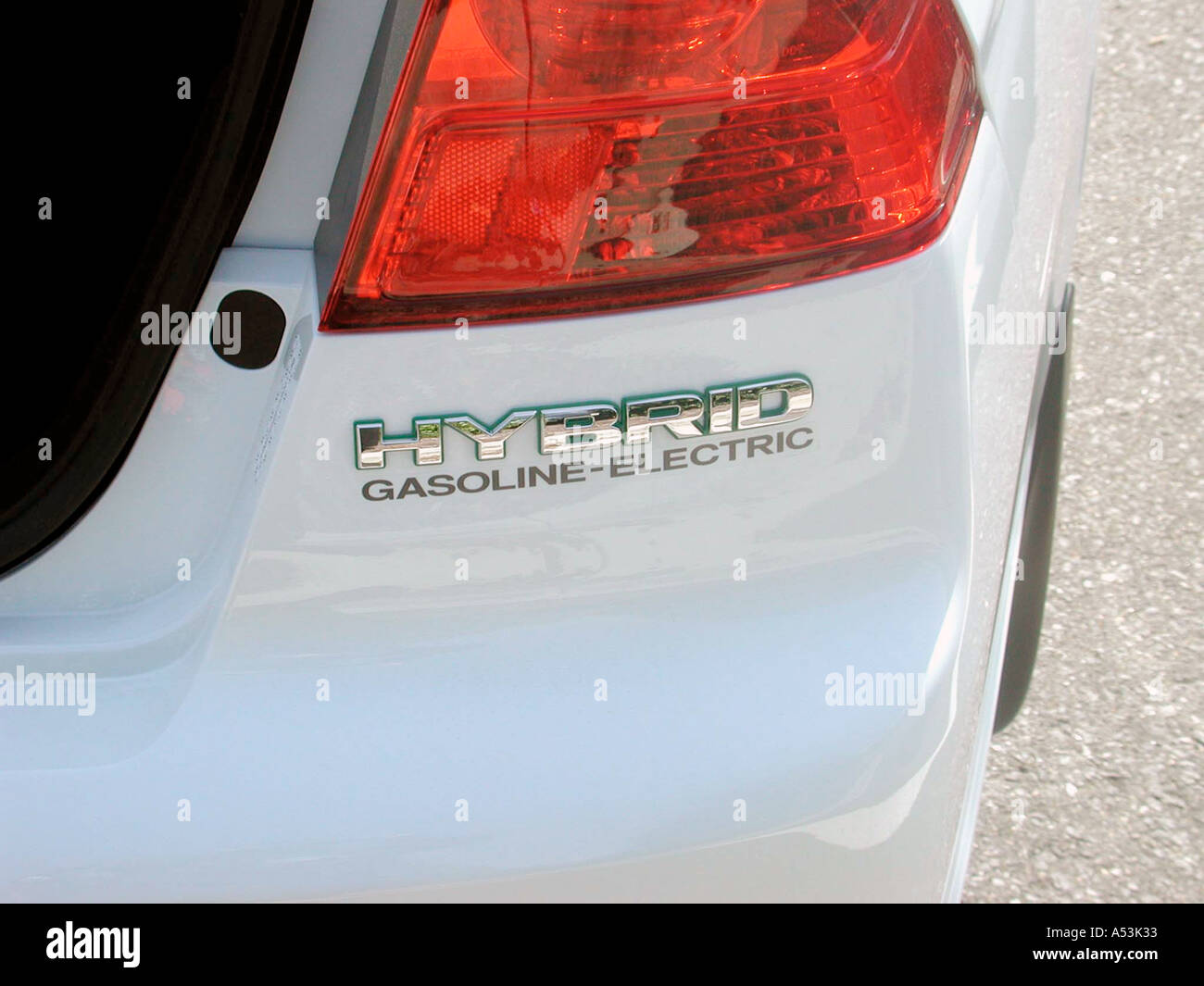 Logo indicating that this car is a hybrid fuel car using both gasoline ...