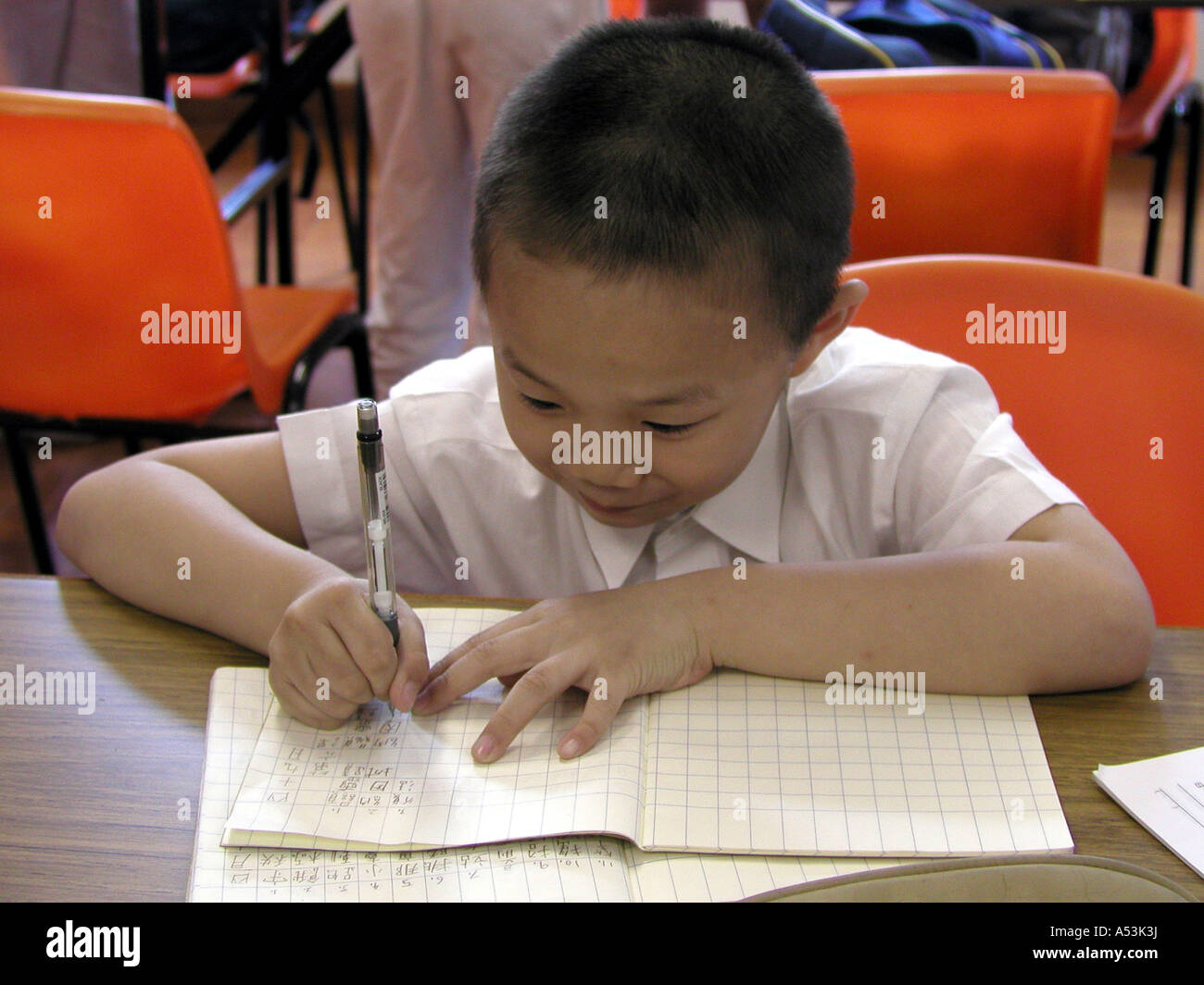 China boy writing hi-res stock photography and images - Alamy