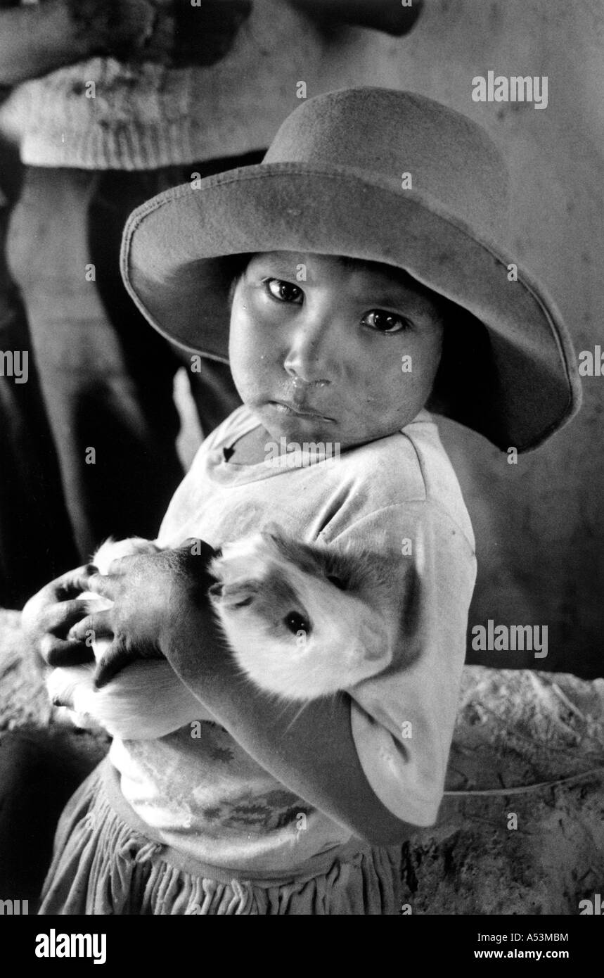 Painet ha1392 206 black and white faces girl guinea pig cachabamba ...